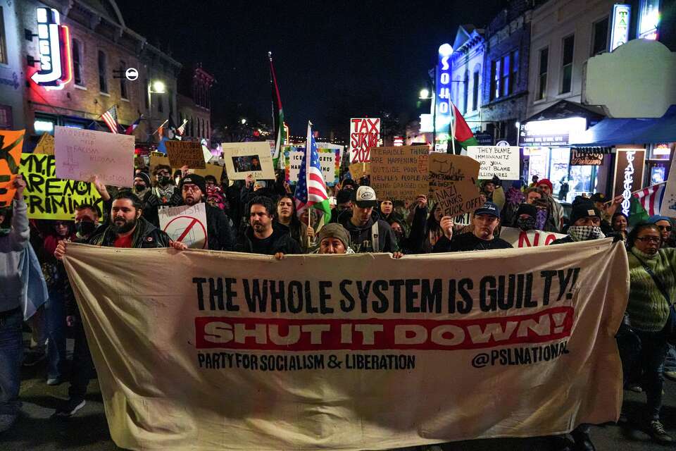 Photos: Austin businesses close, students walk out in anti-ICE protest