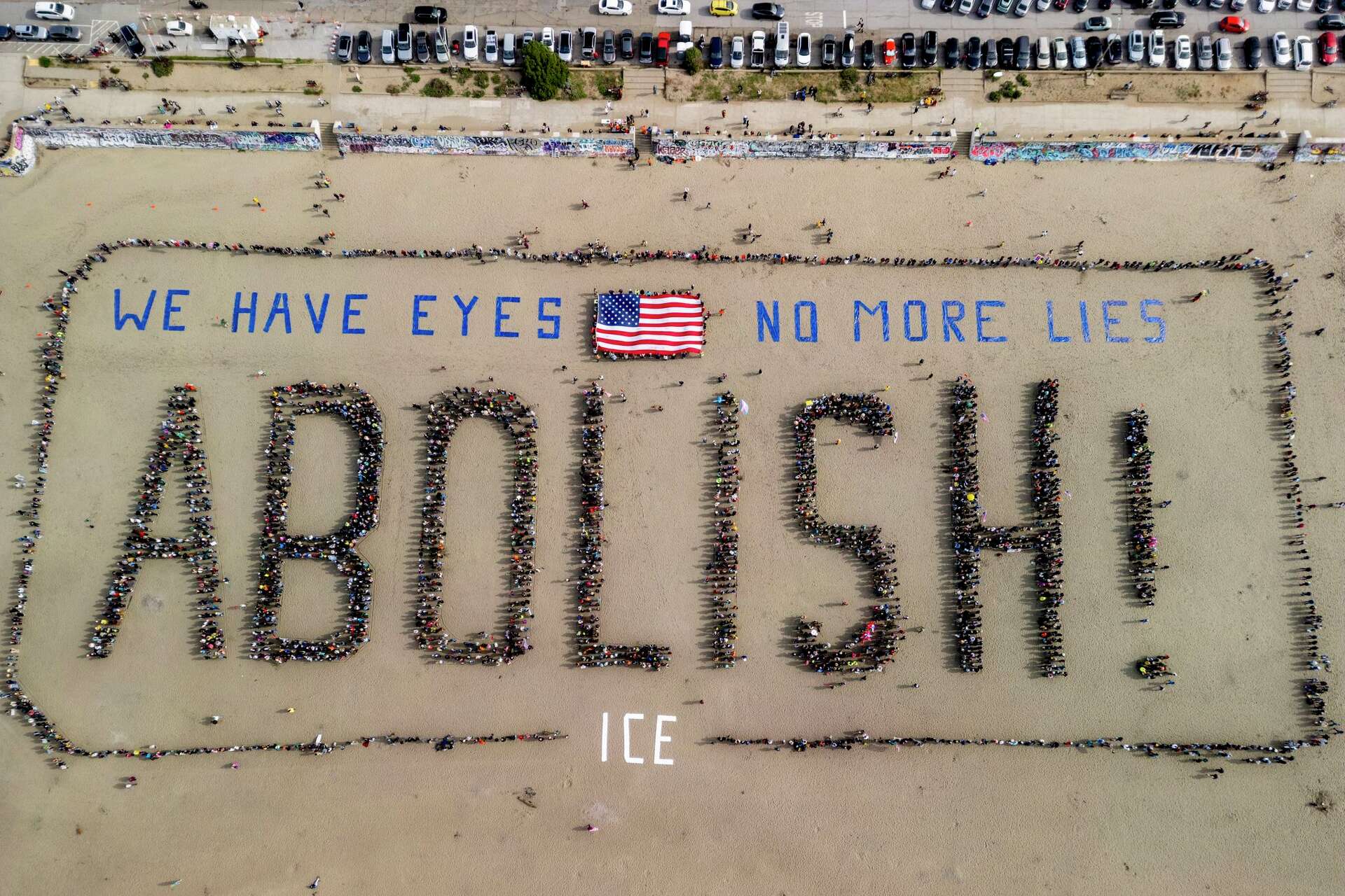 Photos: Thousands of SF protesters form banner with message for ICE