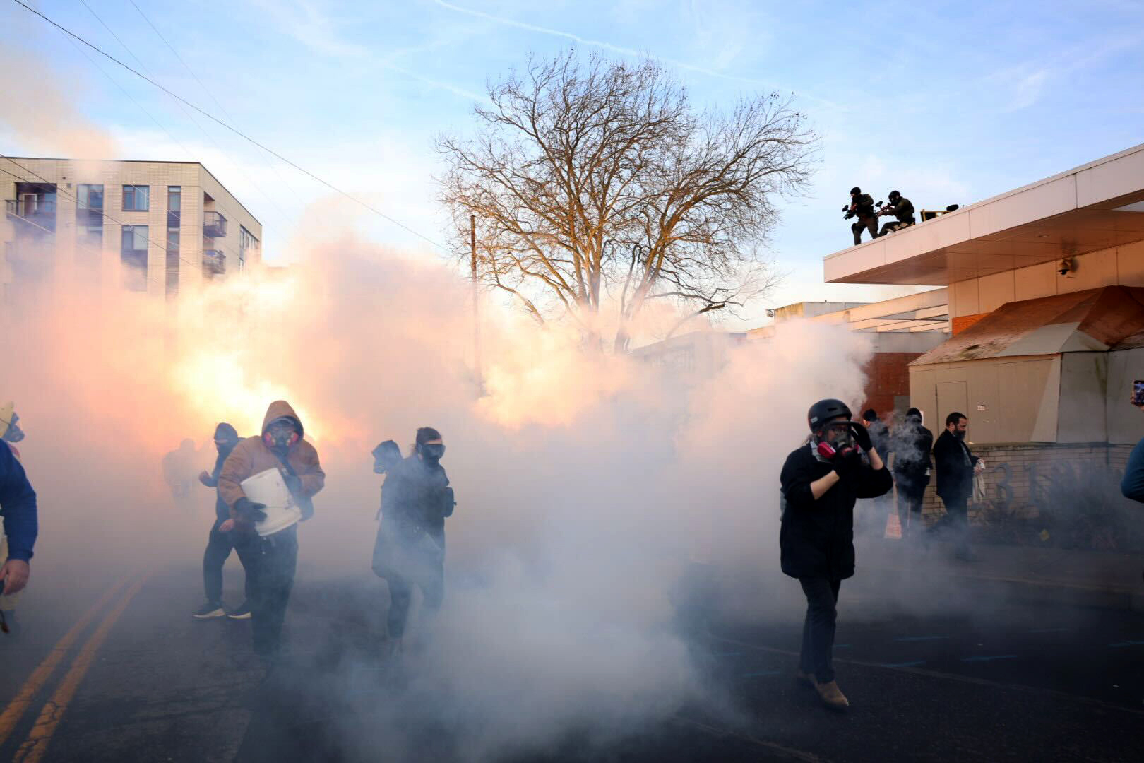 Federal agents must limit tear gas for now at protests outside Portland ...