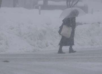 Heavy snow in northern Japan blocks roads and causes dozens of deaths