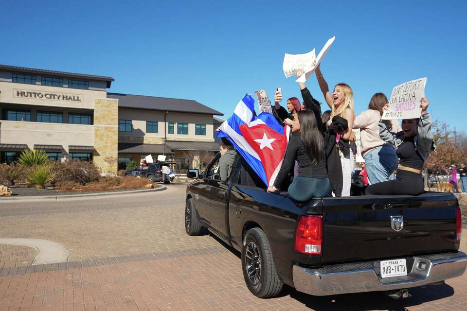 Students protest ICE at Hutto High School, see photos from walkout