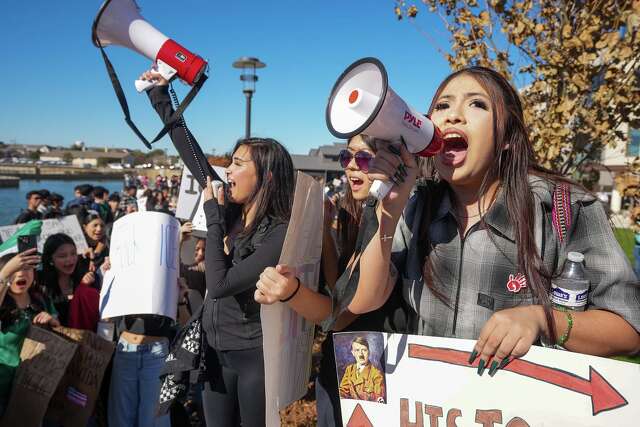 Students protest ICE at Hutto High School, see photos from walkout