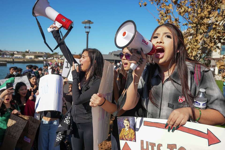 Students protest ICE at Hutto High School, see photos from walkout