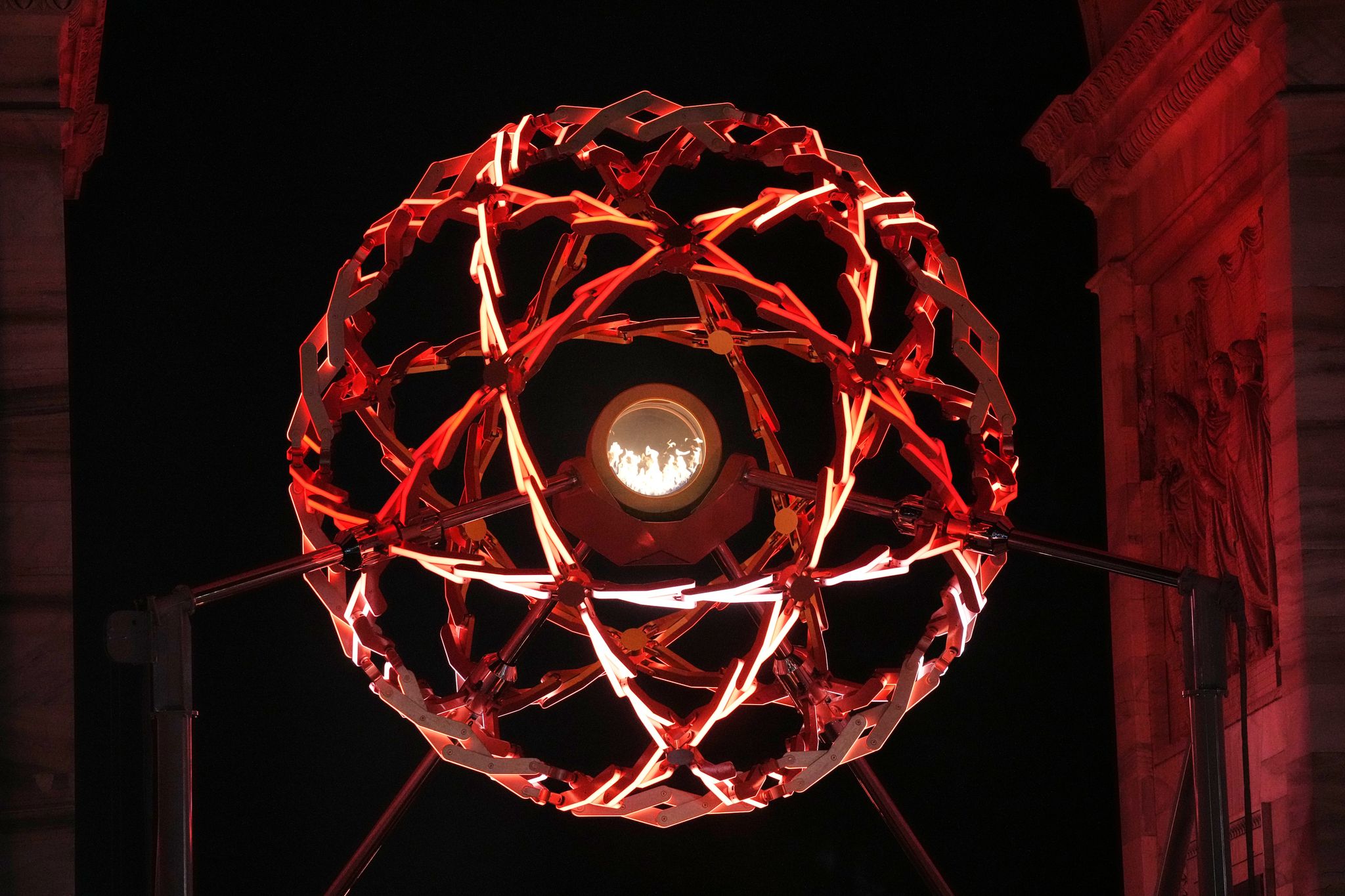 Milan's nightly Olympic cauldron light show draws thousands to Arch of ...