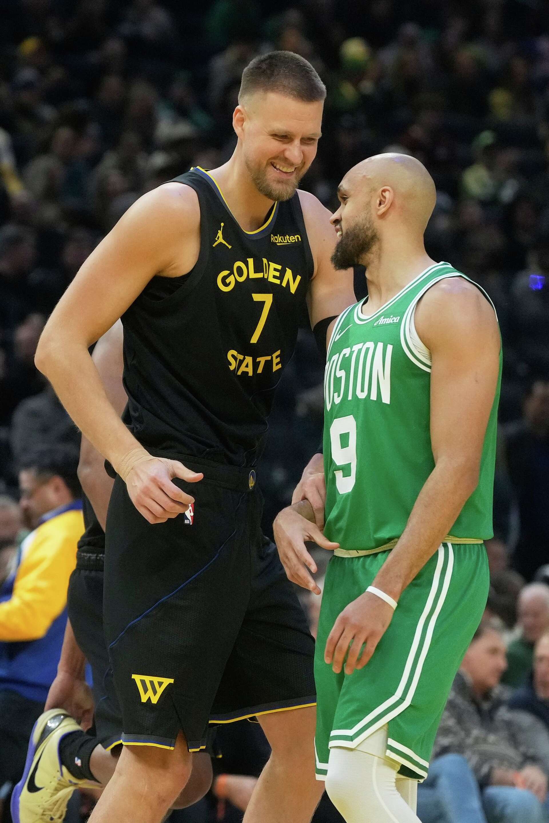 Porzingis solid in debut, but Curry-less Warriors rolled by Boston