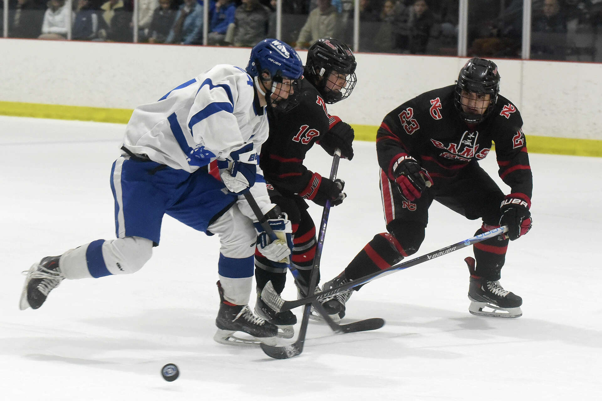 New Canaan boys ice hockey beats Darien in regular season finale