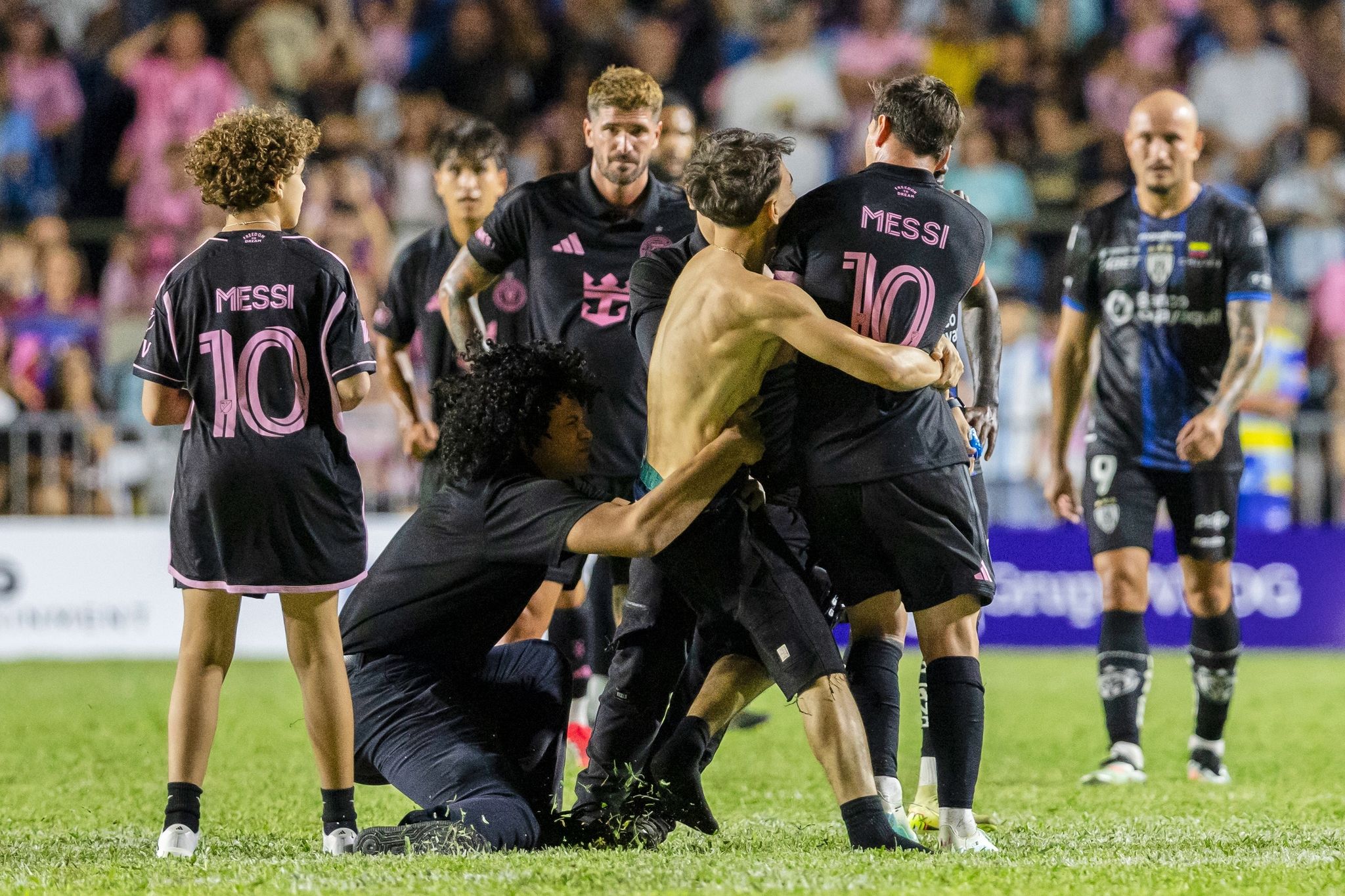 Lionel Messi knocked down as fans storm the pitch during Inter Miami ...