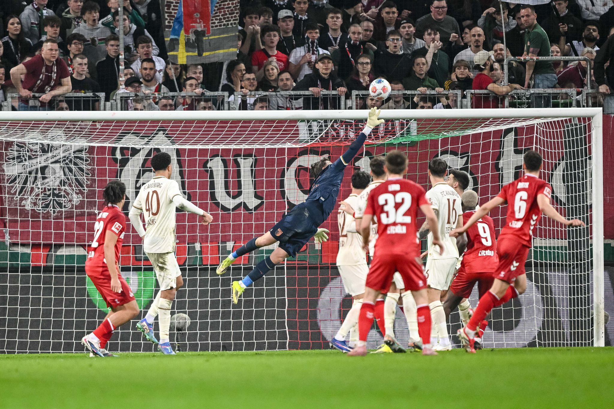 Augsburg beats Cologne to go record-equalling eight straight games ...