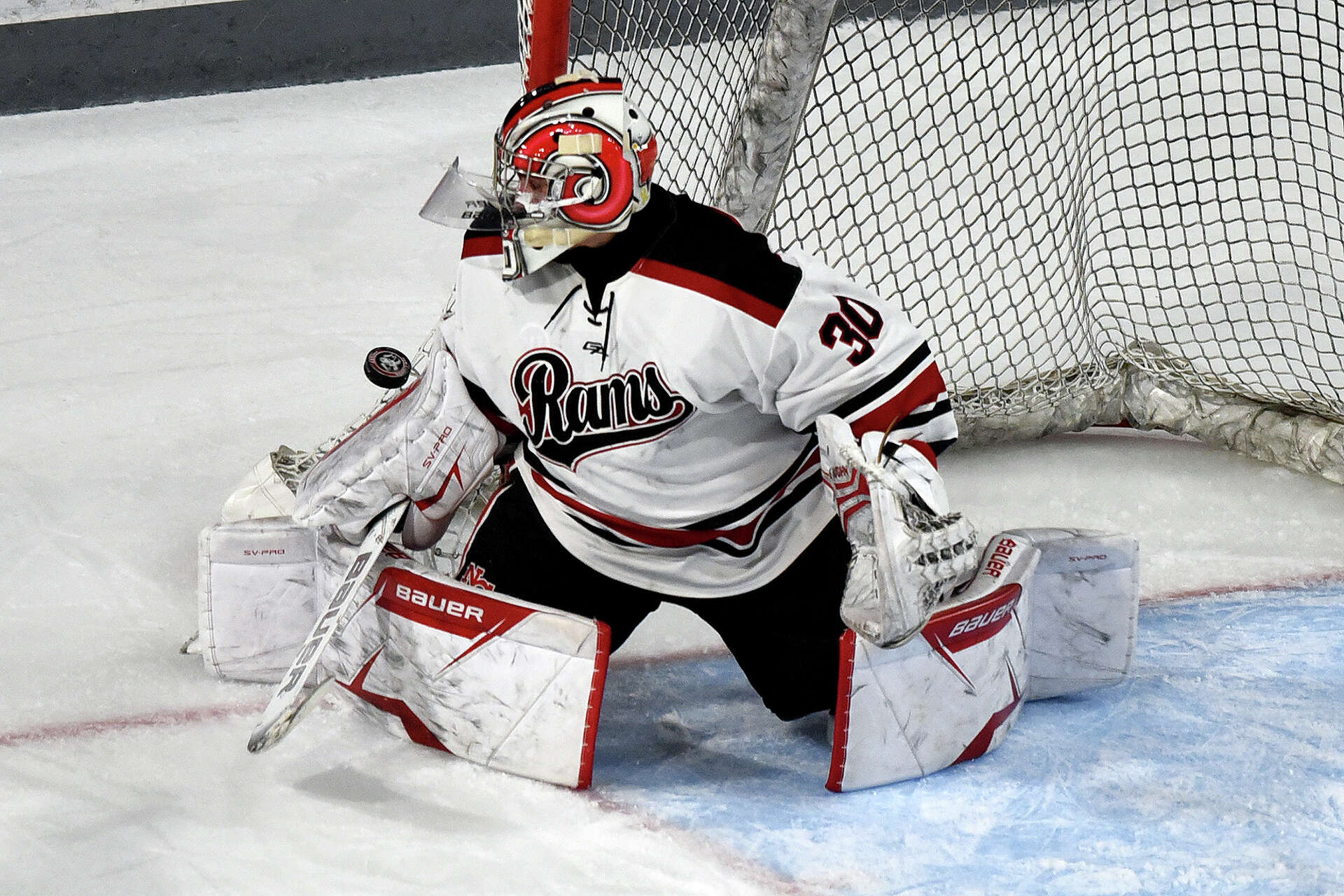New Canaan boys hockey defeated Darien in OT in the FCIAC championship