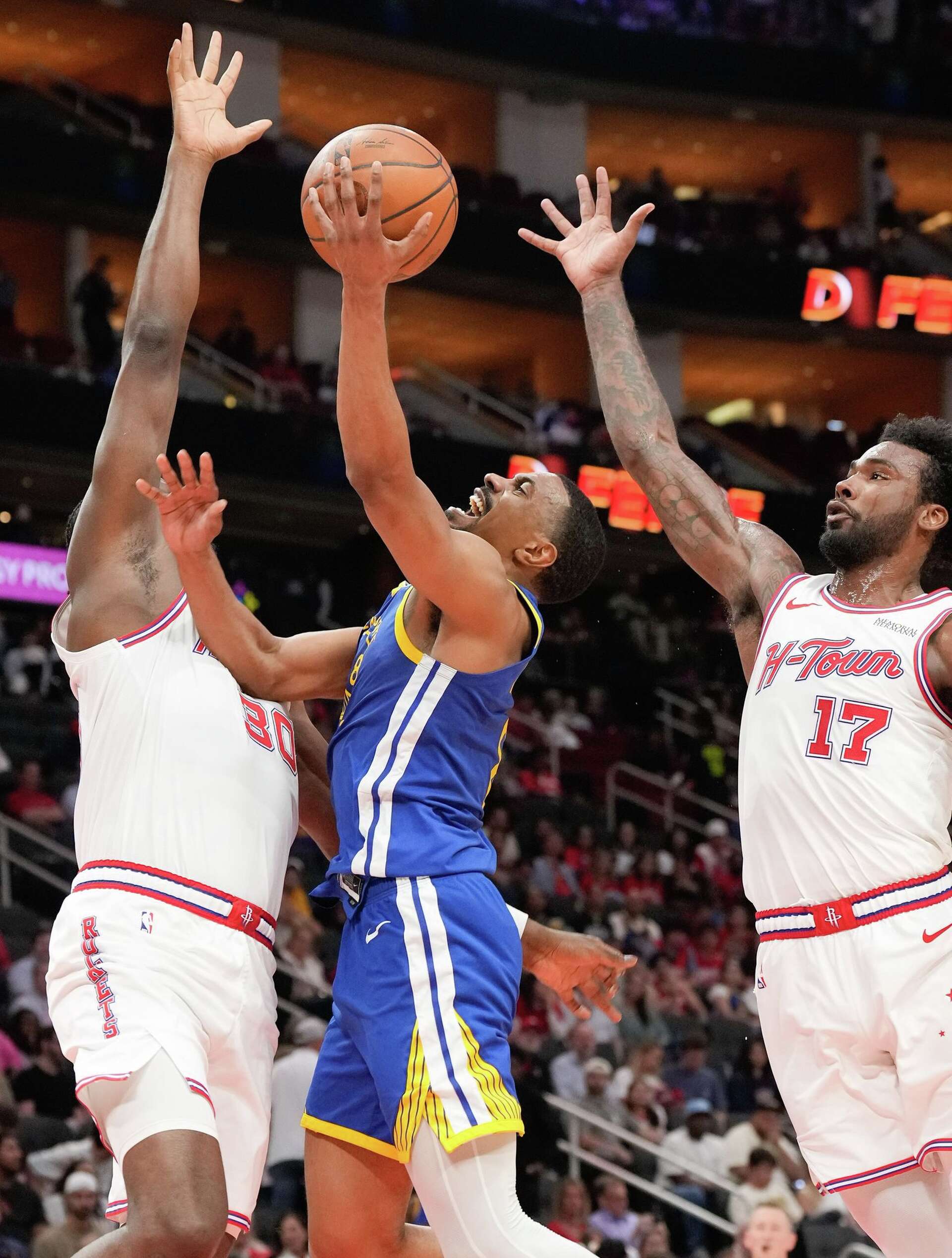 Warriors, mired in slide and minus stars, get OT win in Houston