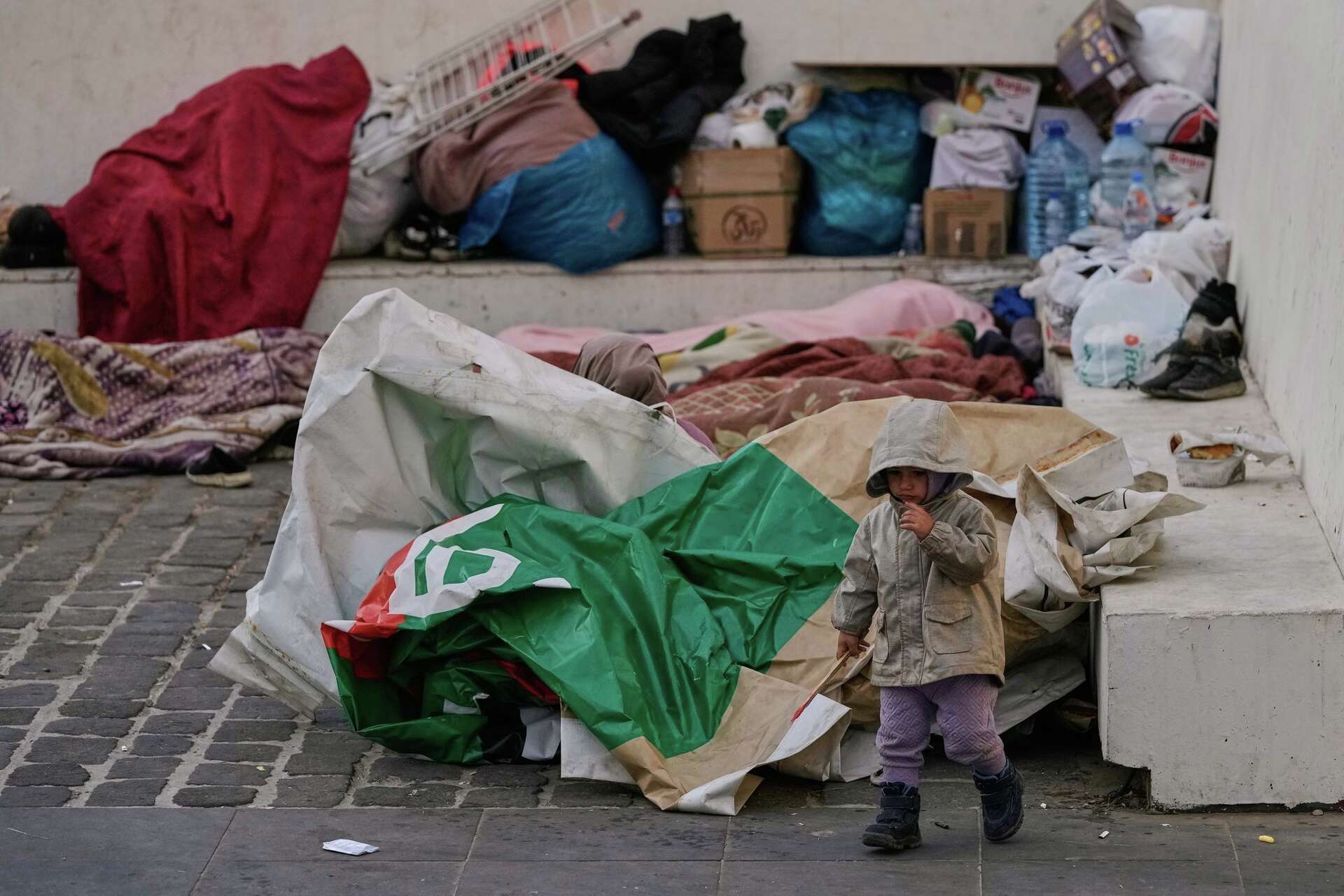 Photos show people fleeing and buildings wrecked after Israeli strikes ...