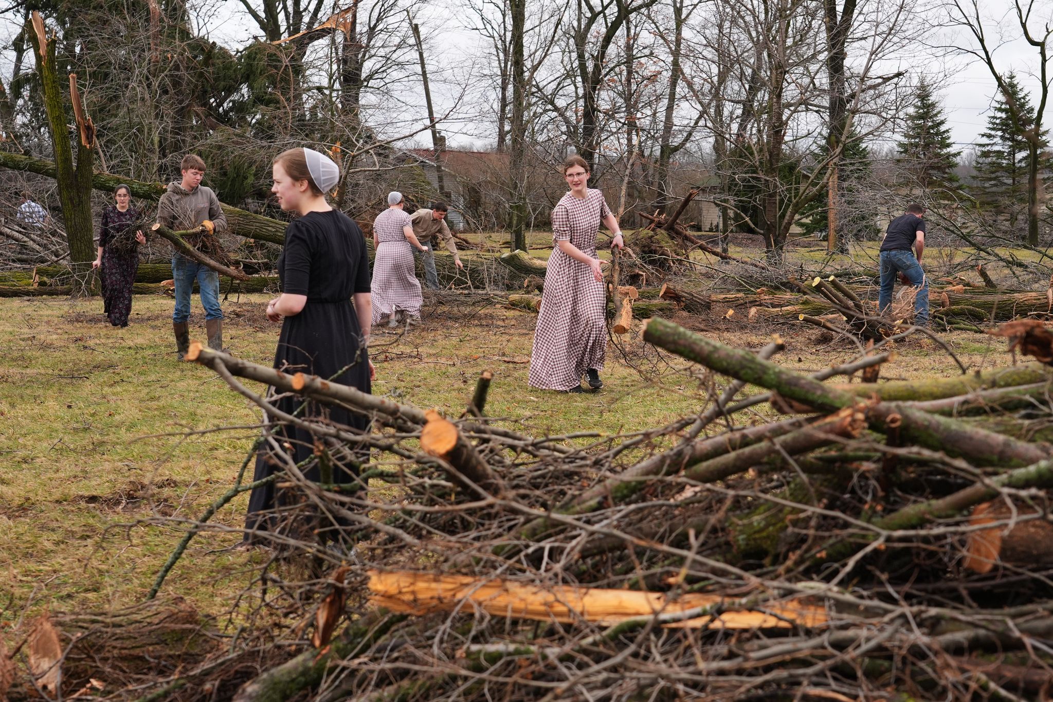 Photos show damage left by powerful storms as volunteers help ...