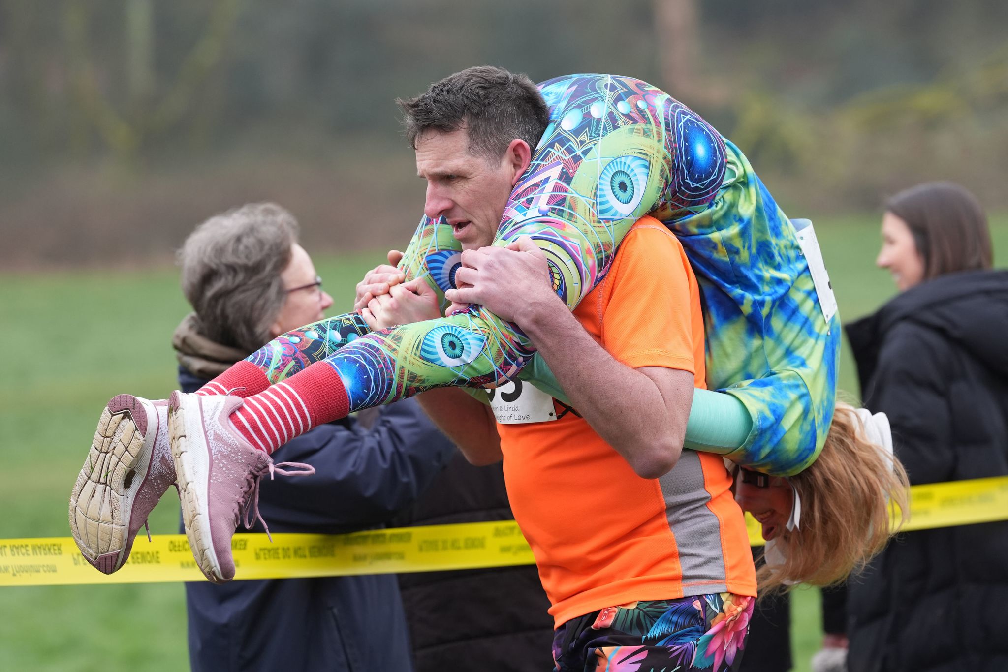Finnish pair wins a barrel of ale in annual 'wife-carrying' contest in ...