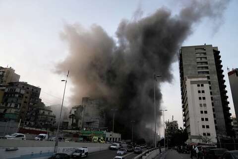 Photos of a central Beirut district struck by Israeli bombs