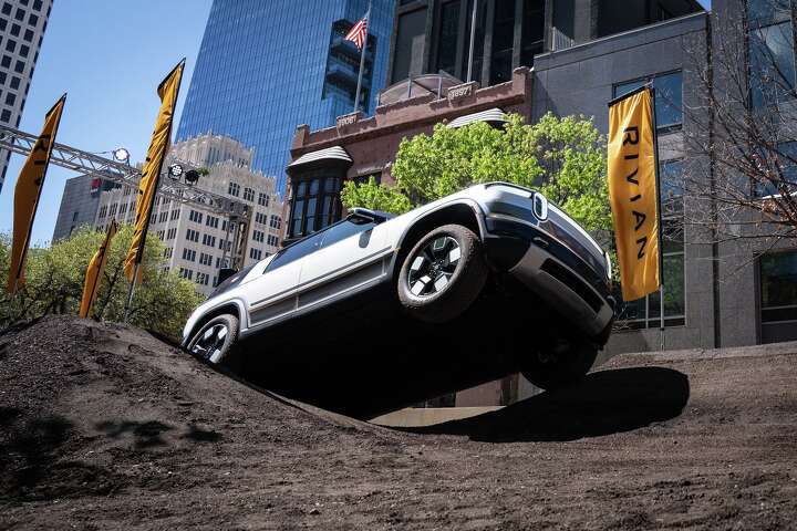 Tesla competitor Rivian to launch robotaxi services with Uber