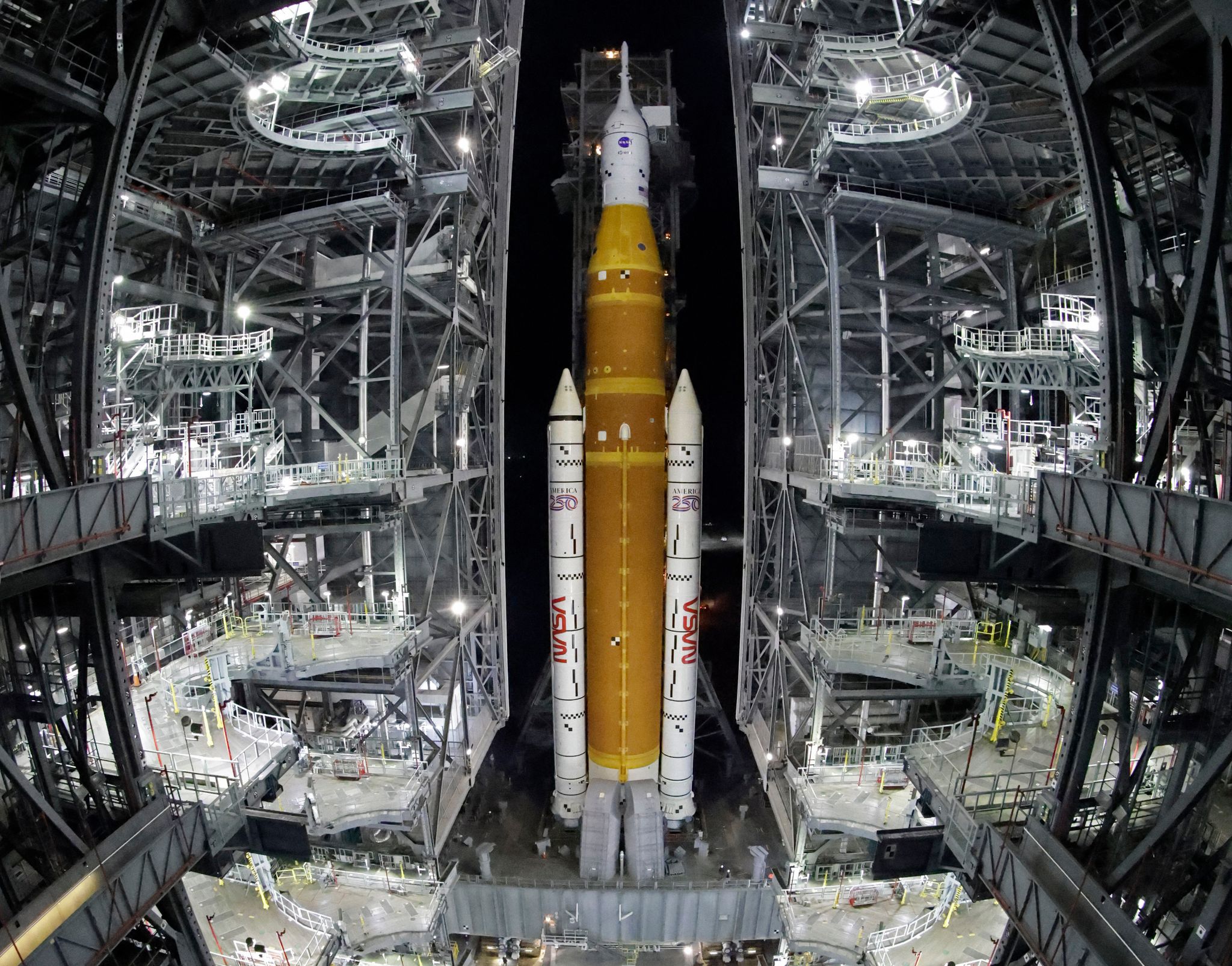 NASA hauls its repaired moon rocket from the hangar back to the pad for ...