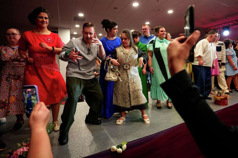 Models with Down syndrome walk a Bucharest runway for World Down ...