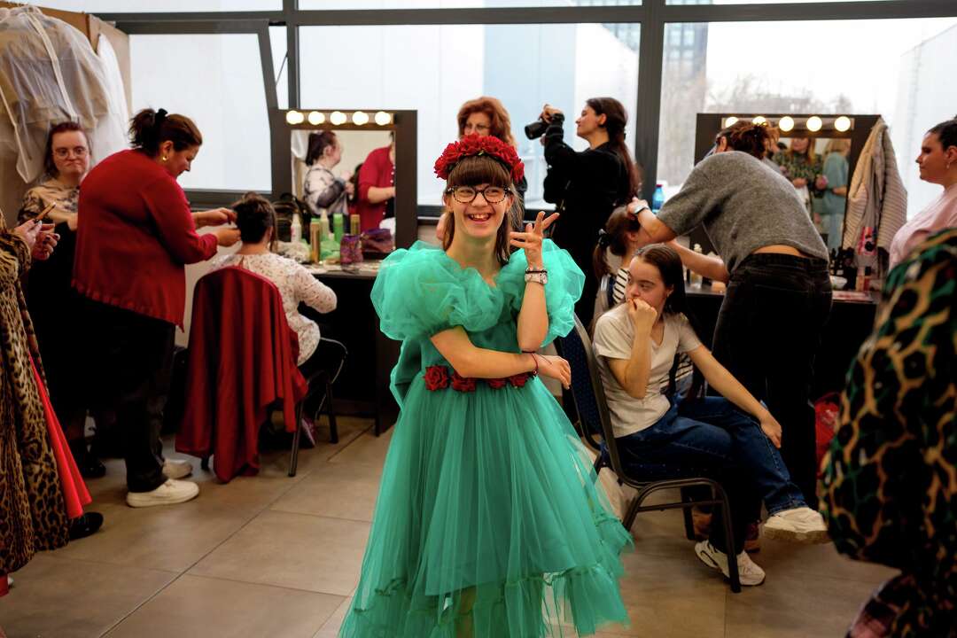 Models with Down syndrome walk a Bucharest runway for World Down ...