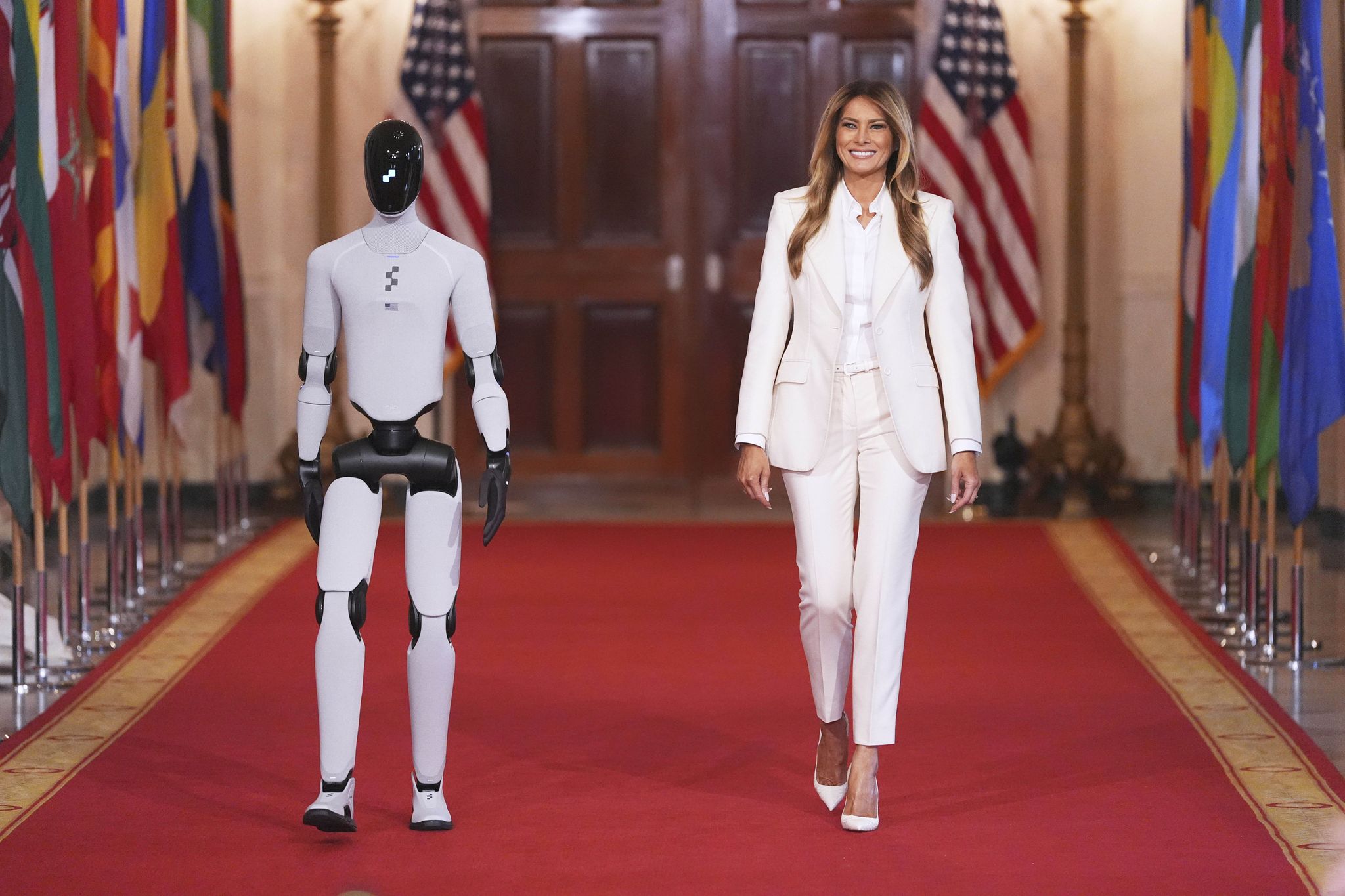 Melania Trump shares the spotlight with a robot at an education and ...