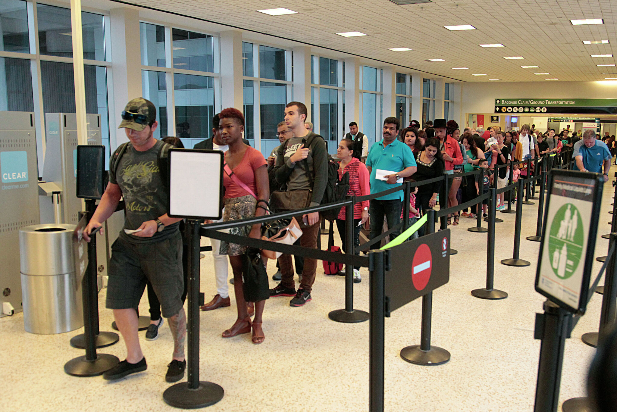 Houston travelers pay strangers to brave airport line nightmare