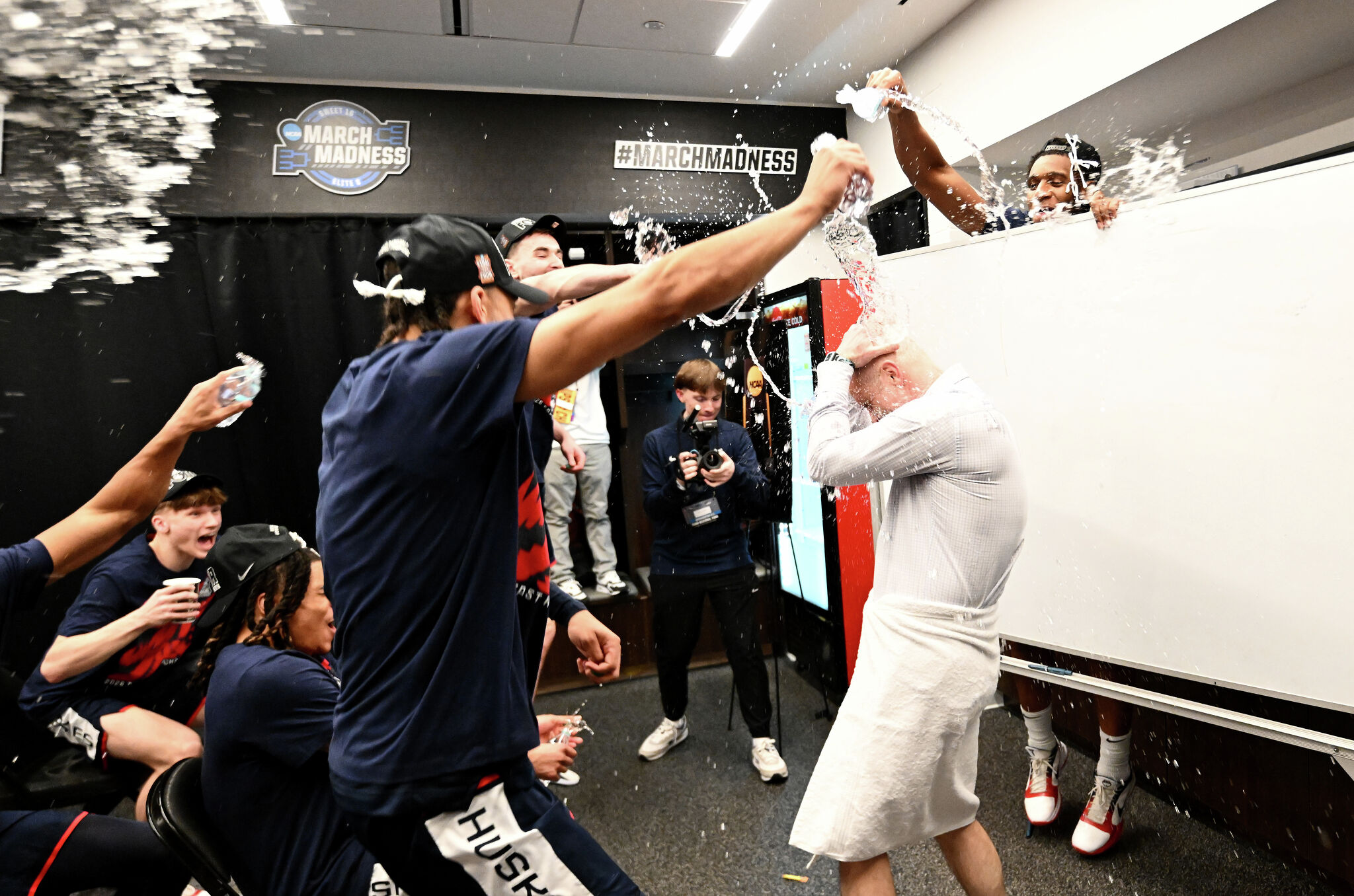 Dan Hurley explains why he wore towel in UConn locker room