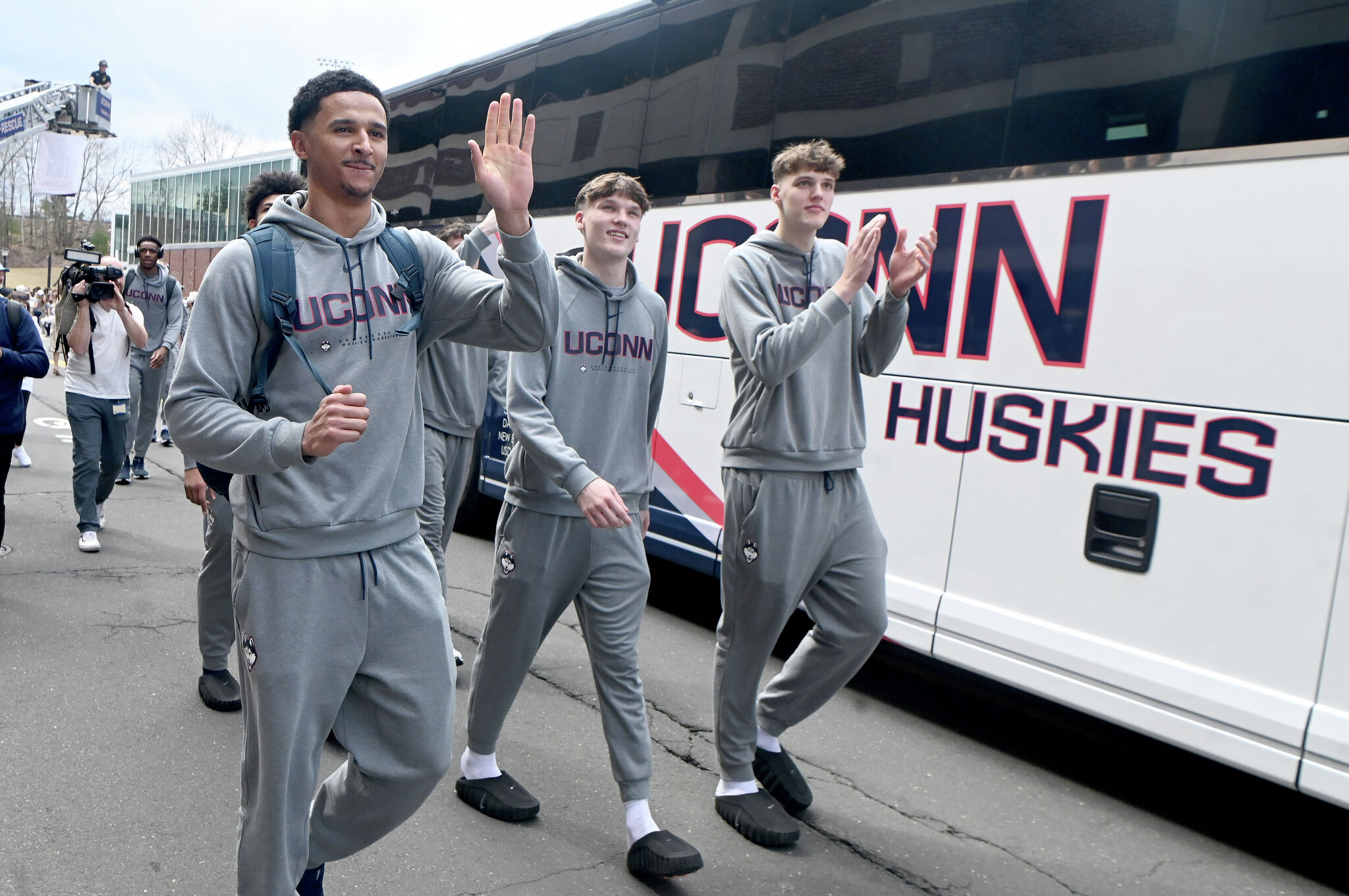 UConn men's basketball team celebrated as they depart for Final Four