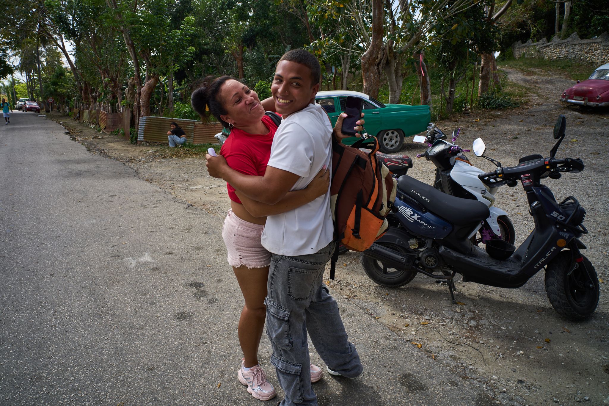 Photos of freed prisoners reuniting with families outside a Cuban prison