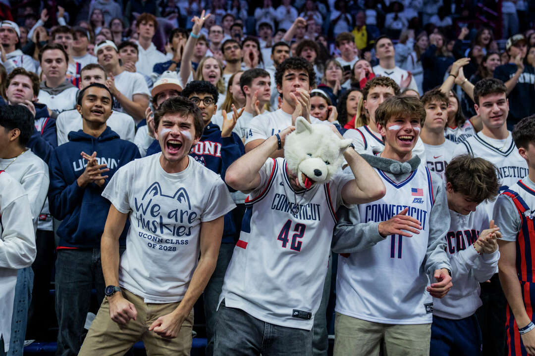 UConn students cover 'M' across campus before Michigan game