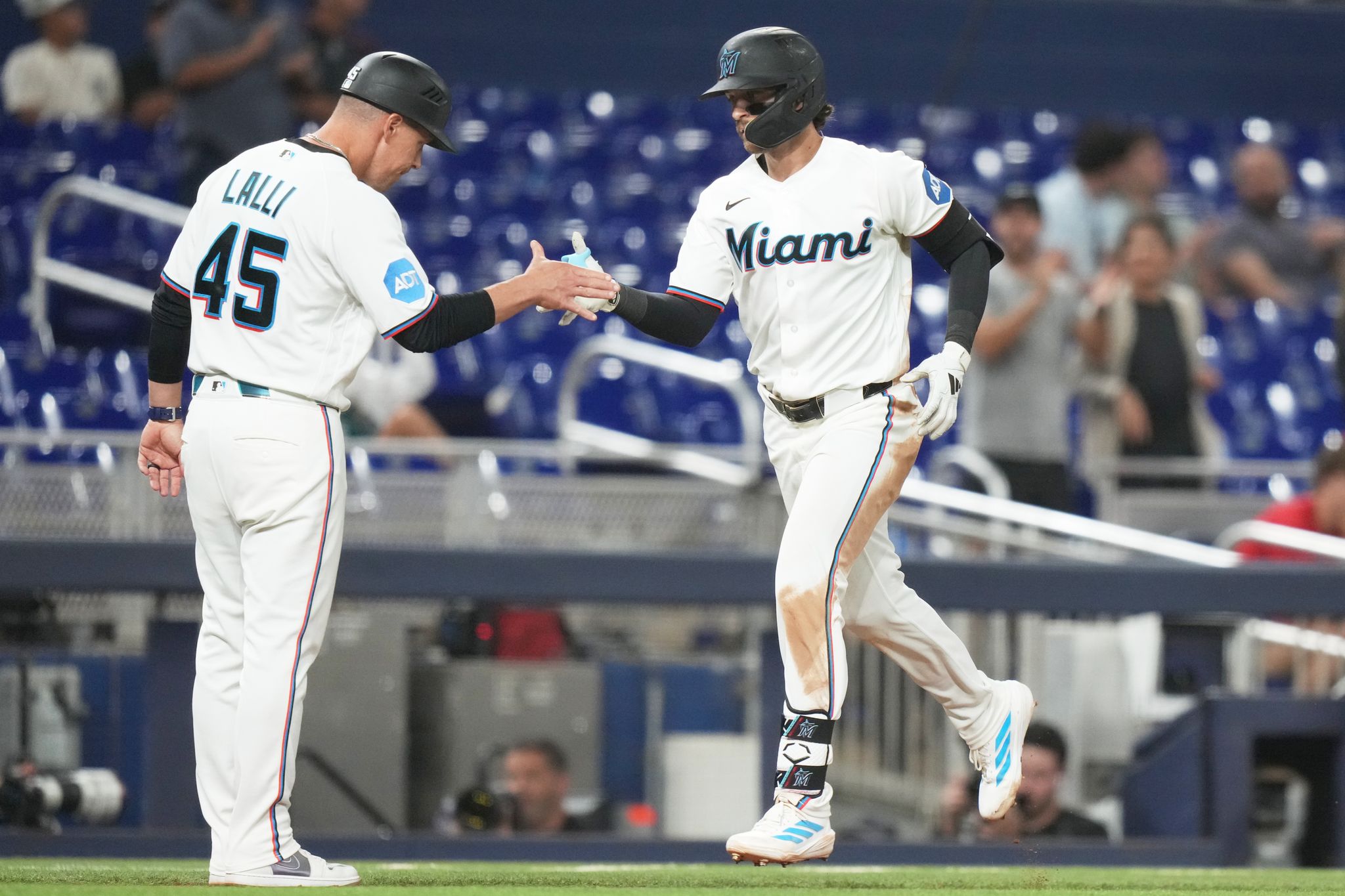 Conine and Norby homer to lead the Marlins to a 7-4 win over the Reds