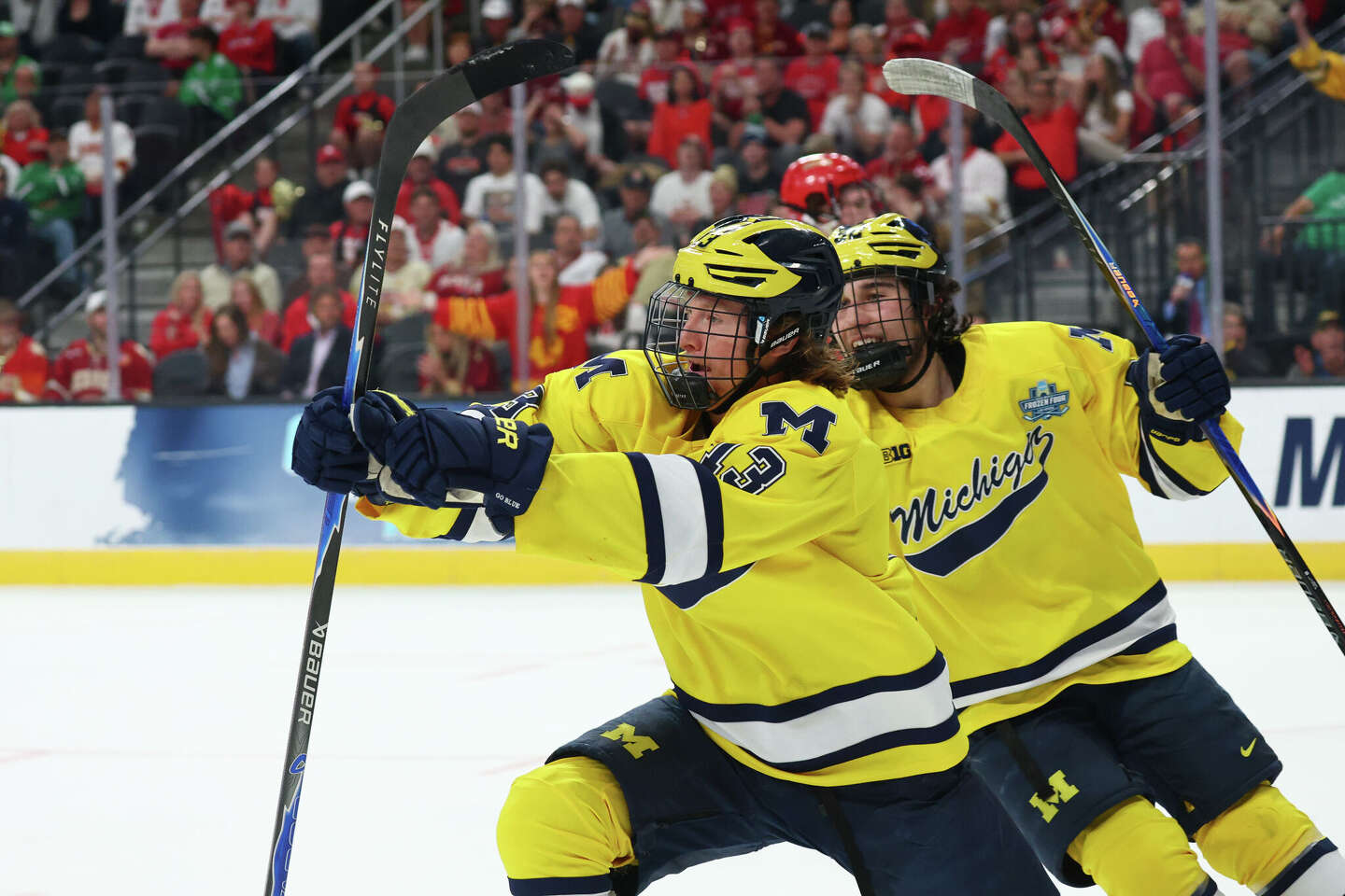 Denver, Wisconsin win Frozen Four games, to play for national title
