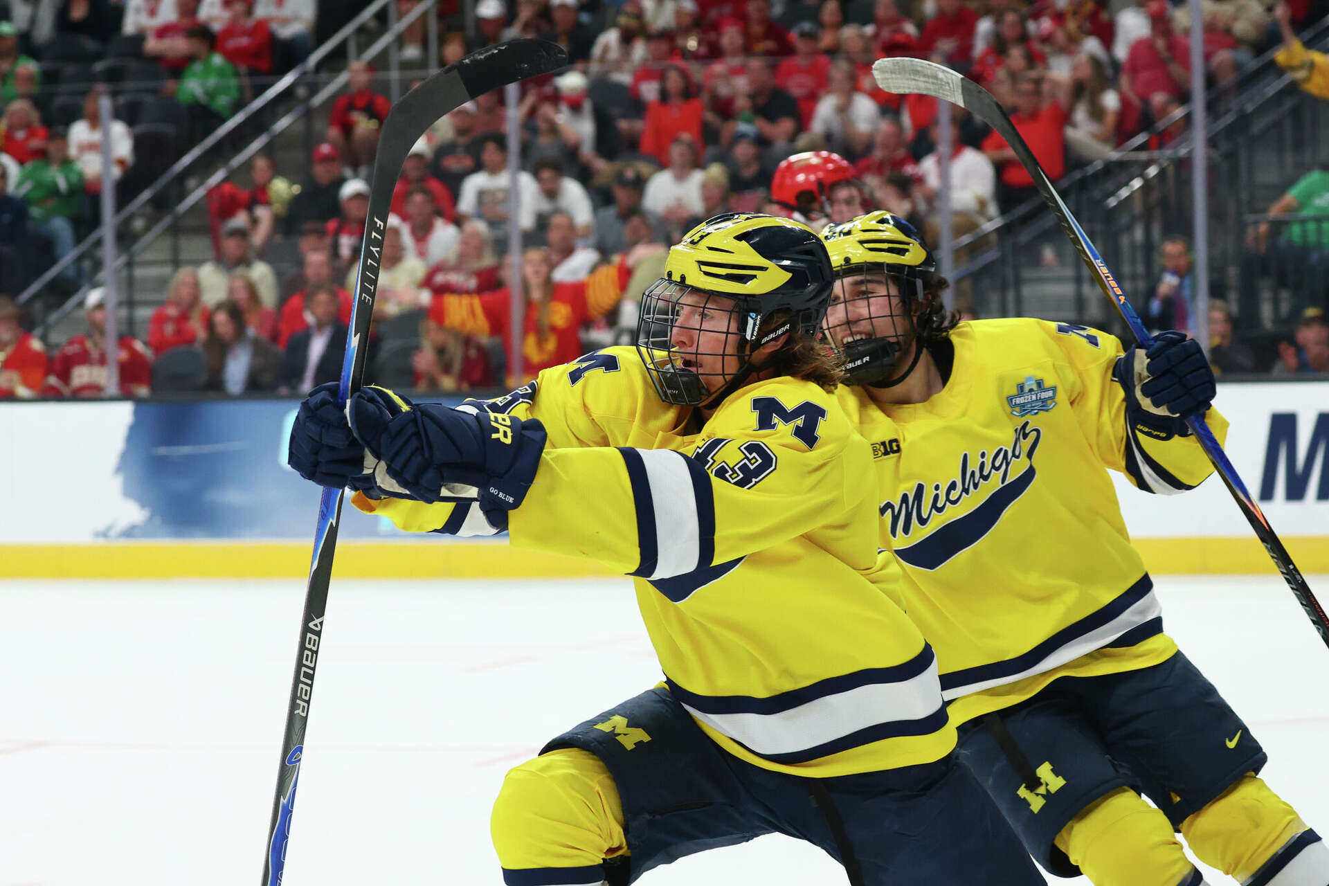 Denver, Wisconsin win Frozen Four games, to play for national title