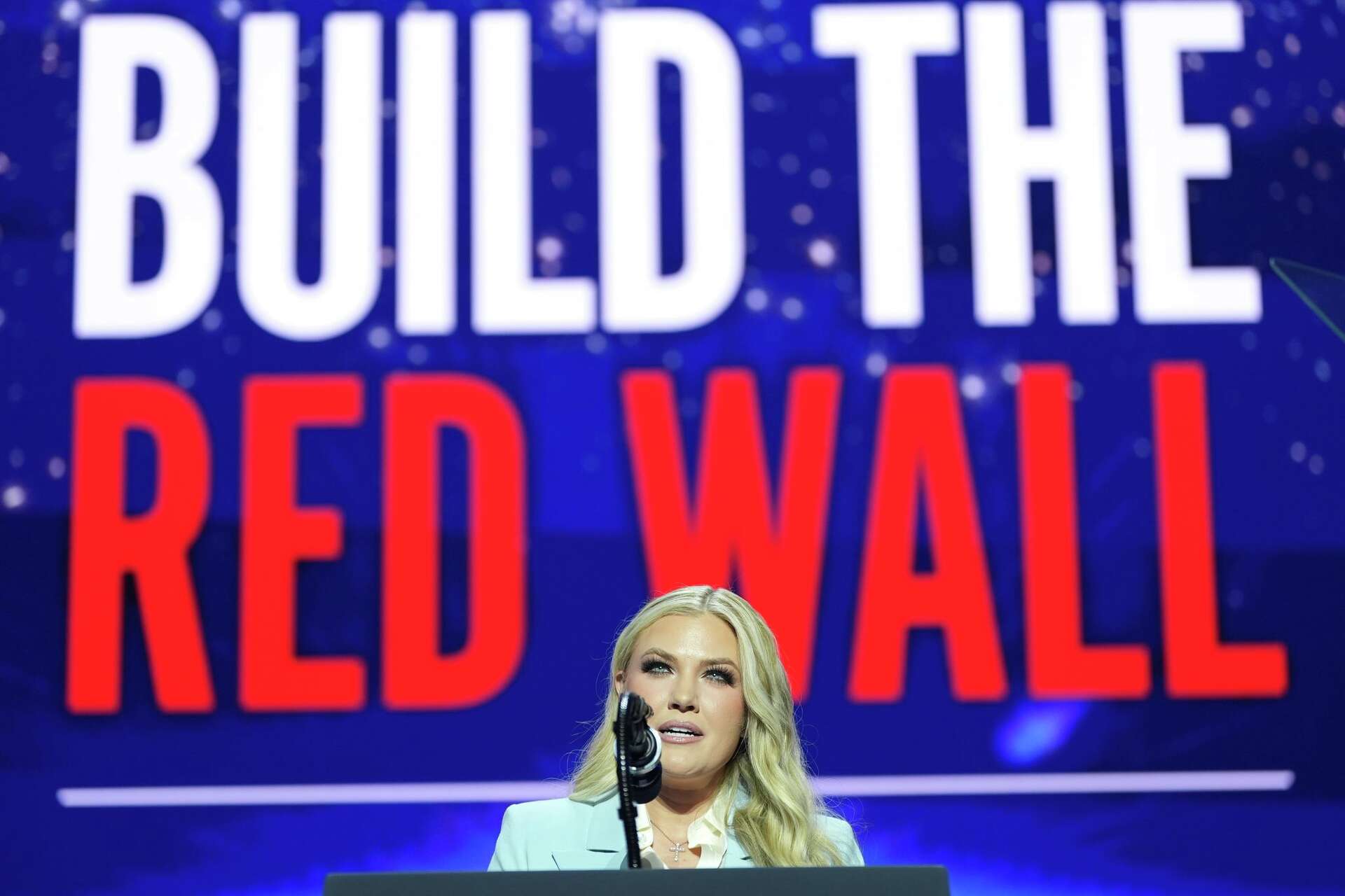 Photos show the 'Build the Red Wall' rally in Arizona, headlined by Trump