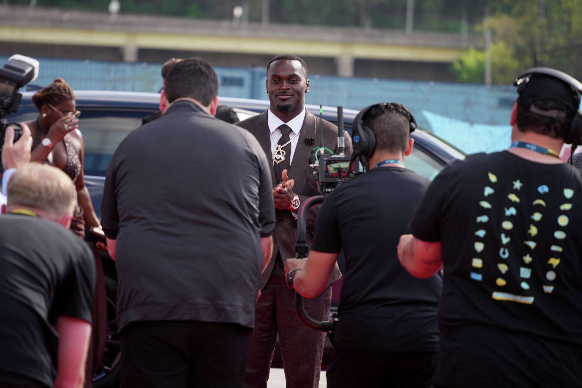 Inside the NFL draft suits: Family photos, sponsor art and a comic book ...
