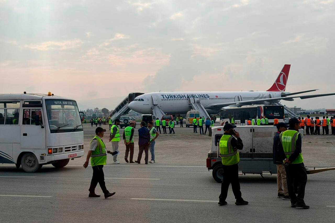 Turkish Airlines jet safely evacuated after landing gear smoke at Nepal ...