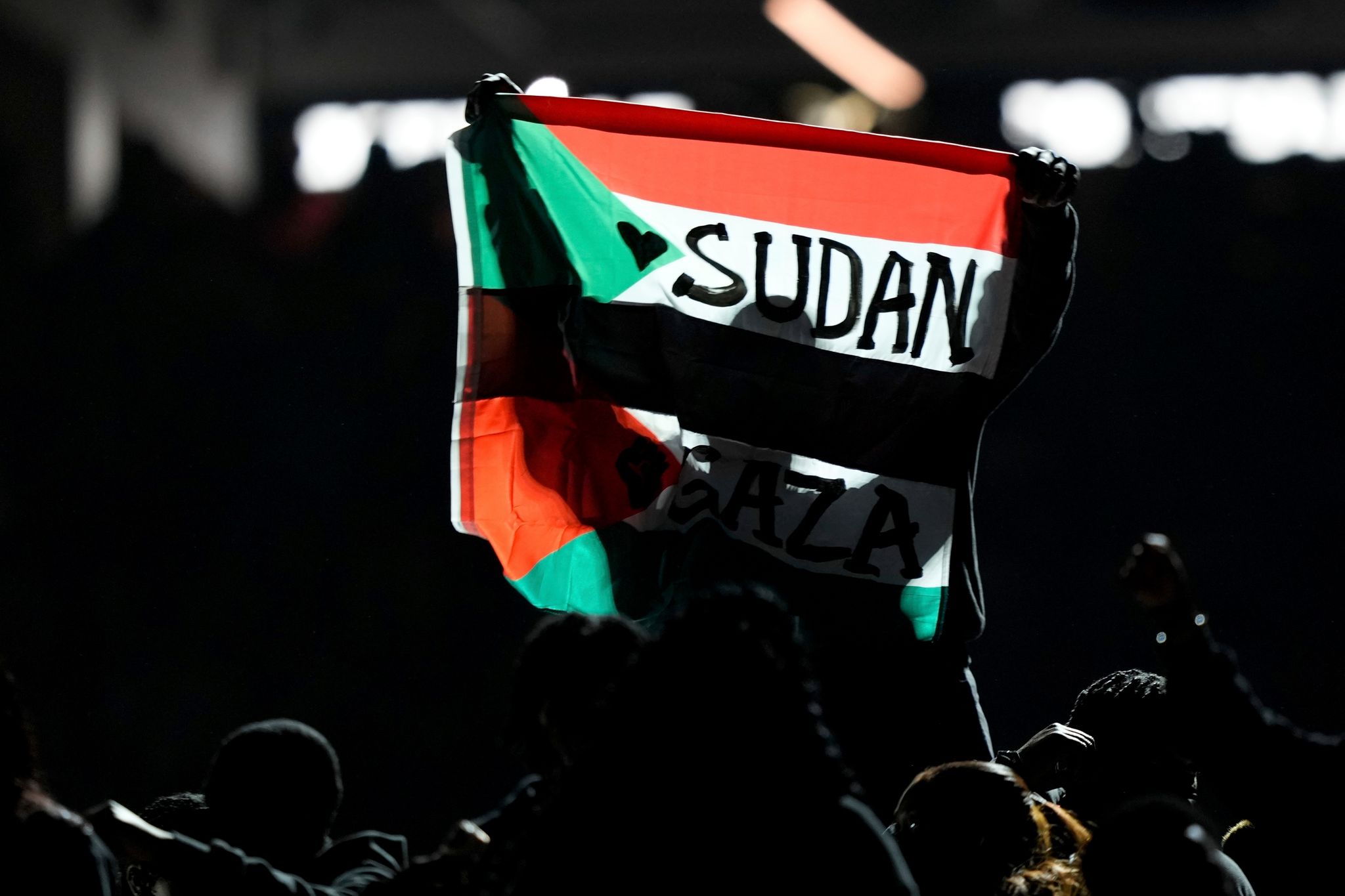 Super Bowl halftime performer who ran with a protest flag is found ...