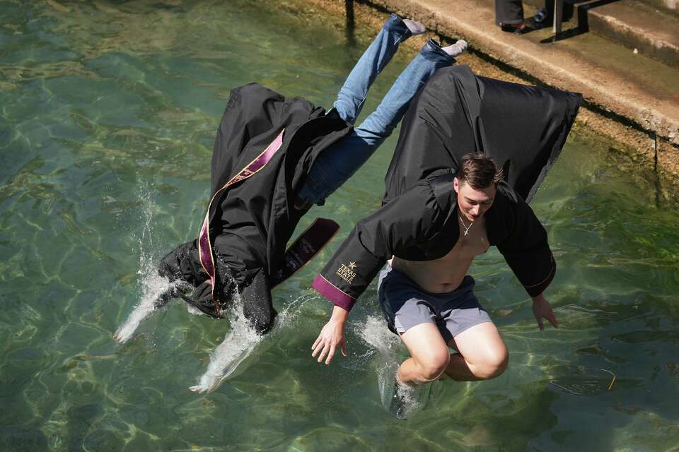Texas State graduates jump into San Marcos River after commencement