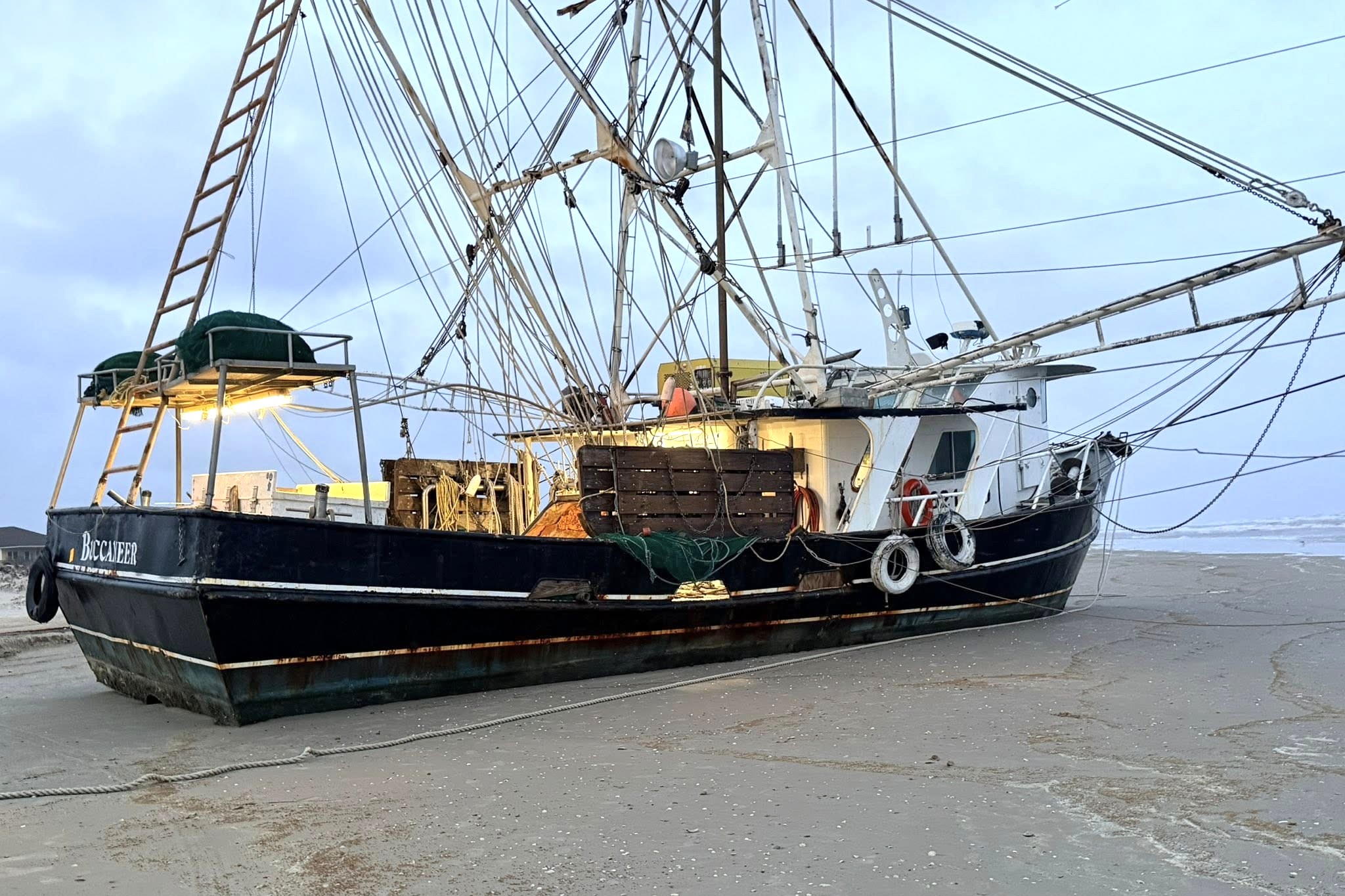 A Texas beach now has an unexpected attraction: A stranded shrimp boat