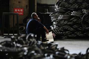 China’s factory activity slows in May, raising questions over its economy