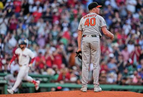 Orioles place Chris Bassitt on IL with back pain and recall Trey Gibson ...
