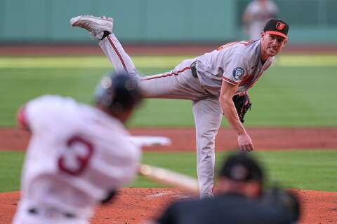 Orioles place Chris Bassitt on IL with back pain and recall Trey Gibson ...