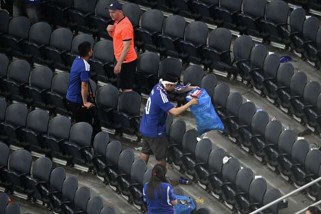Japan fans use blue bags to uphold a cleansing World Cup tradition ...