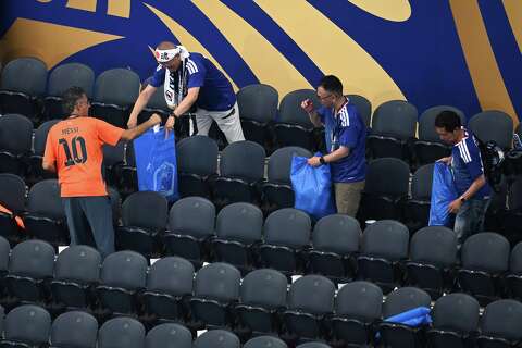 Japan fans use blue bags to uphold a cleansing World Cup tradition ...