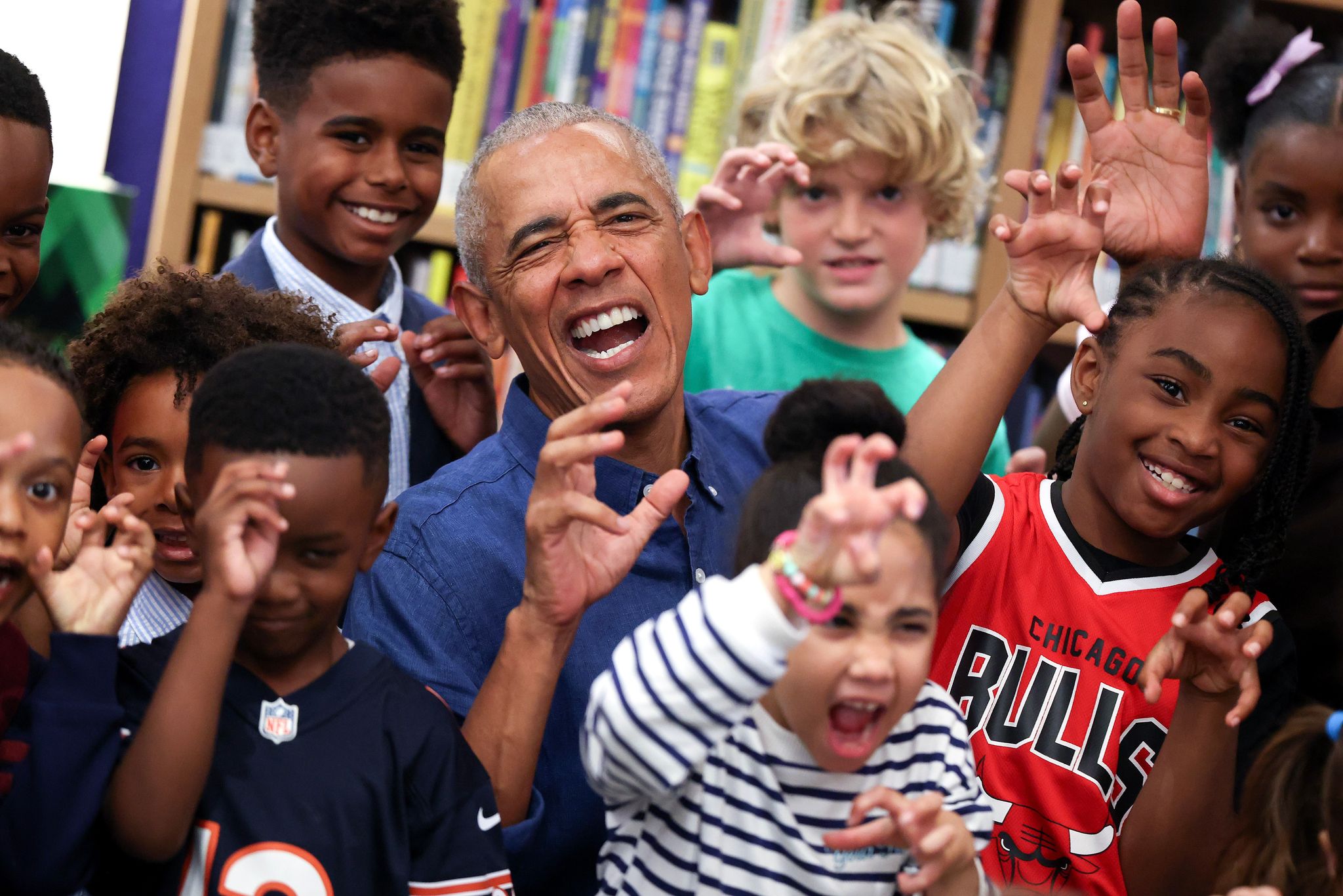 Barack and Michelle Obama surprise first visitors to newly opened ...