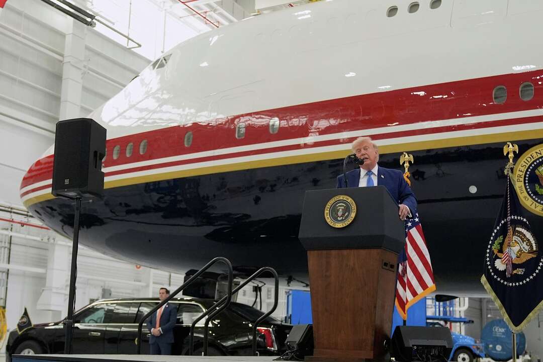 President Donald Trump unveils the new Air Force One, a converted ...