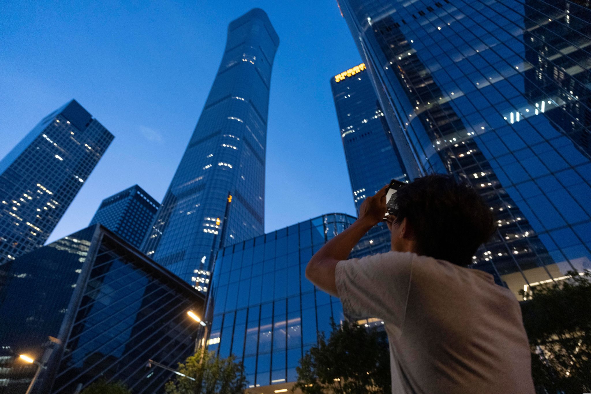 A small plane has crashed into a Beijing high-rise, killing the pilot ...