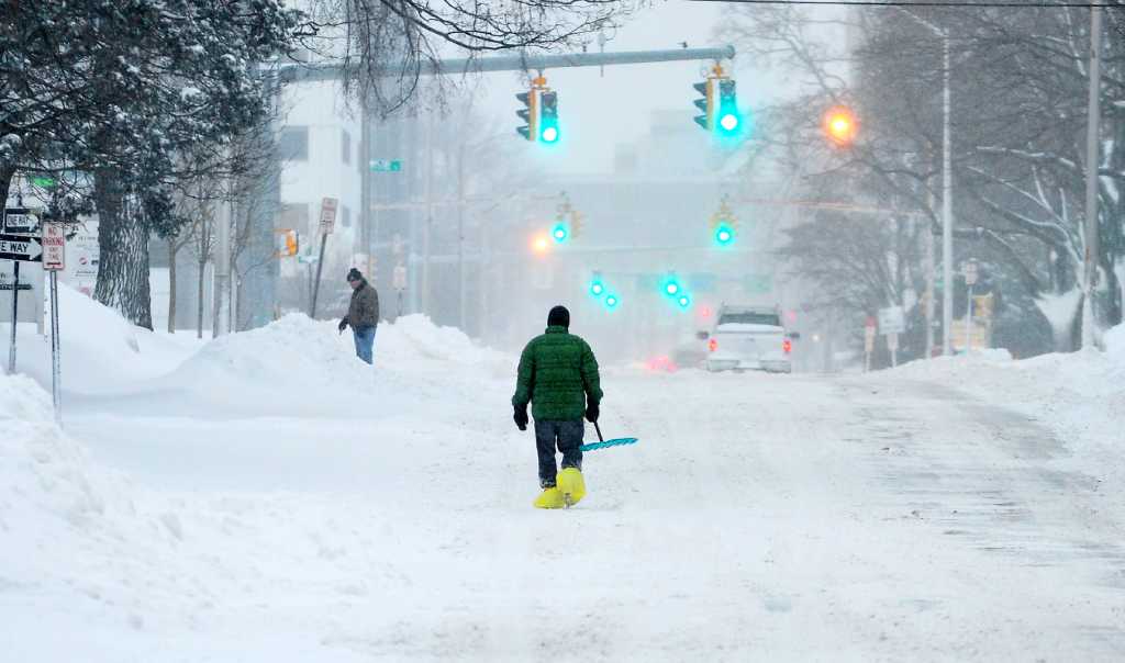 Snow day: cities clean up as workers stay home