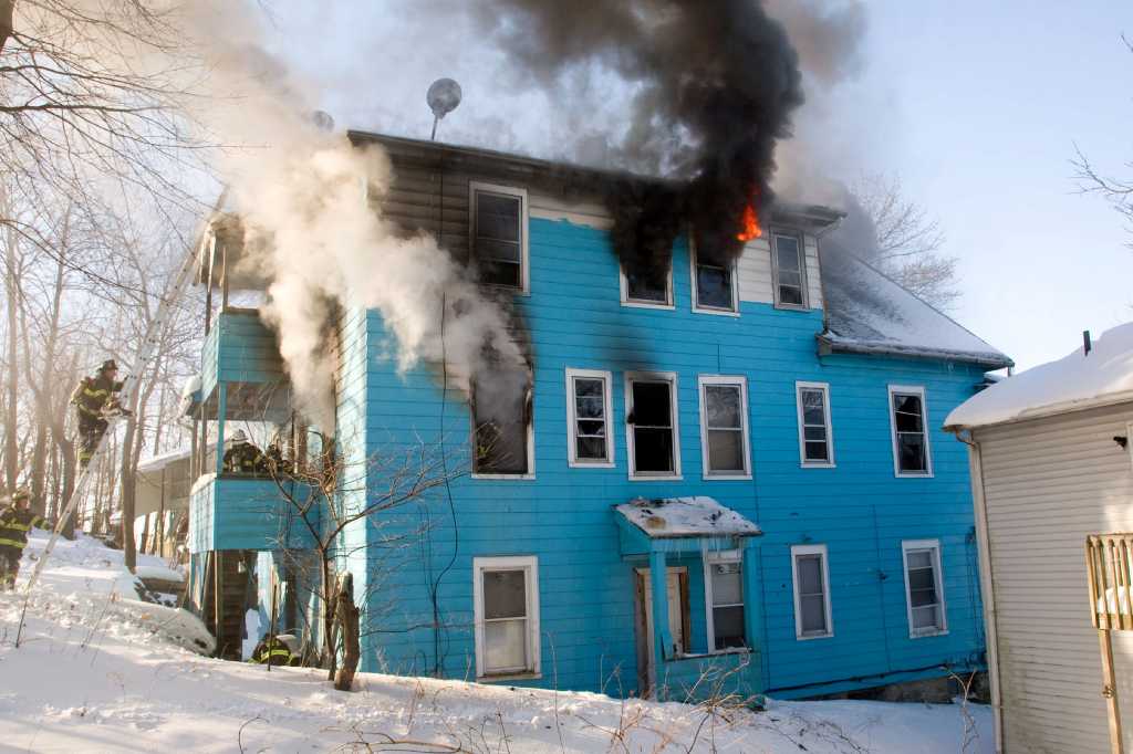 Fire in 3-family house leaves 15 people homeless