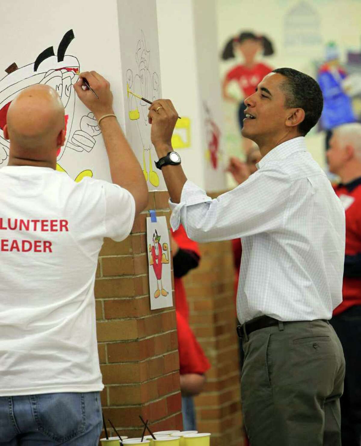 Obamas travel to DC school for King holiday