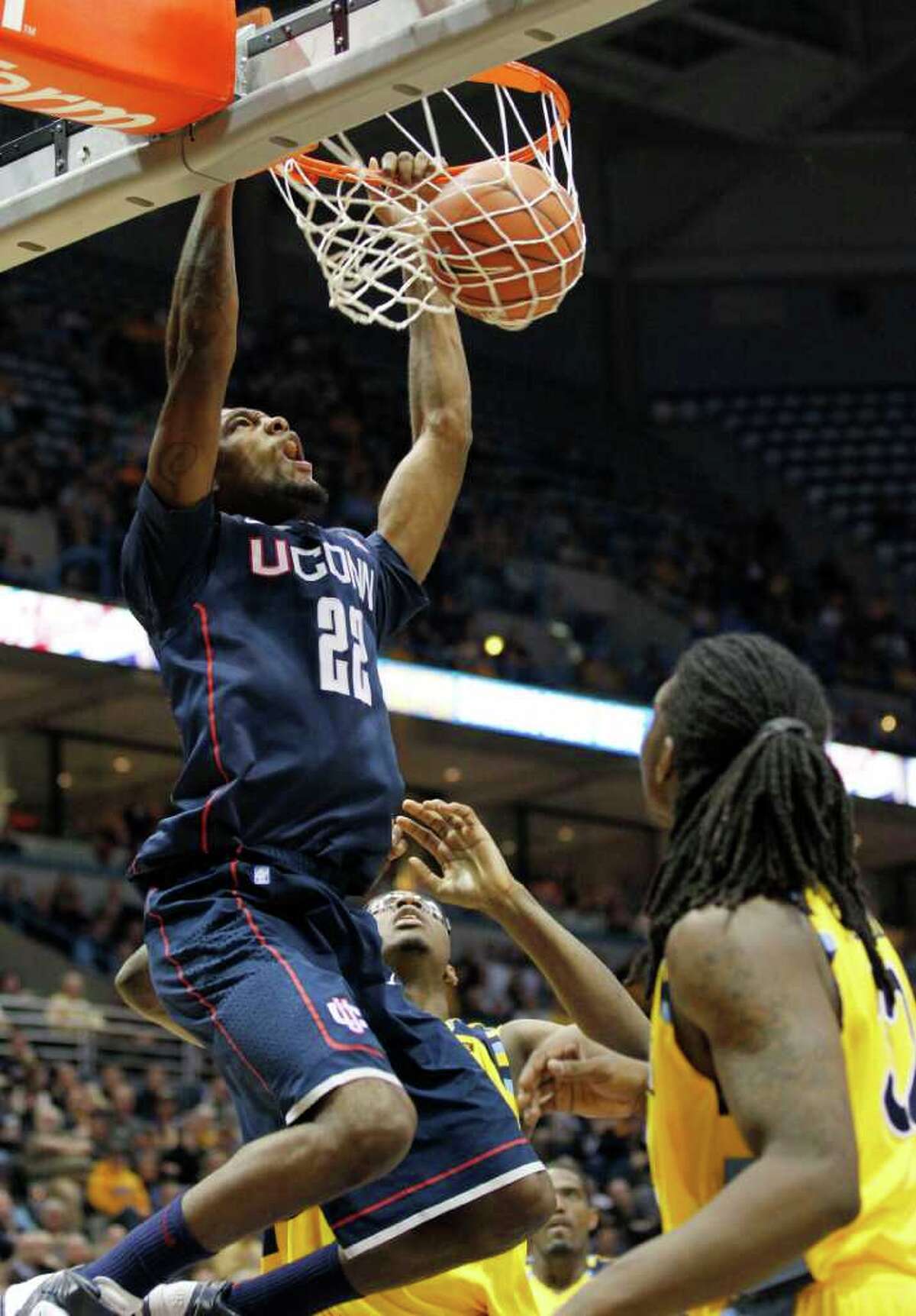 Late 13-0 run elevates UConn past Marquette
