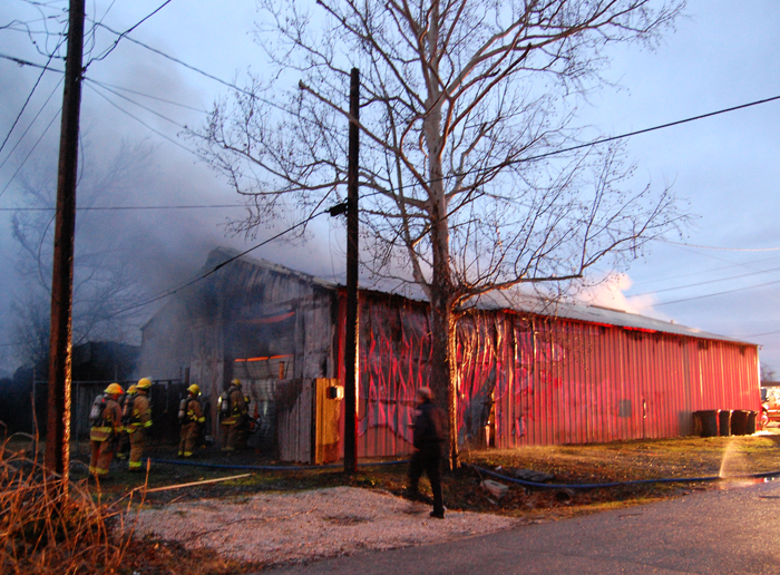 Work light sparks auto shop fire, one man burned